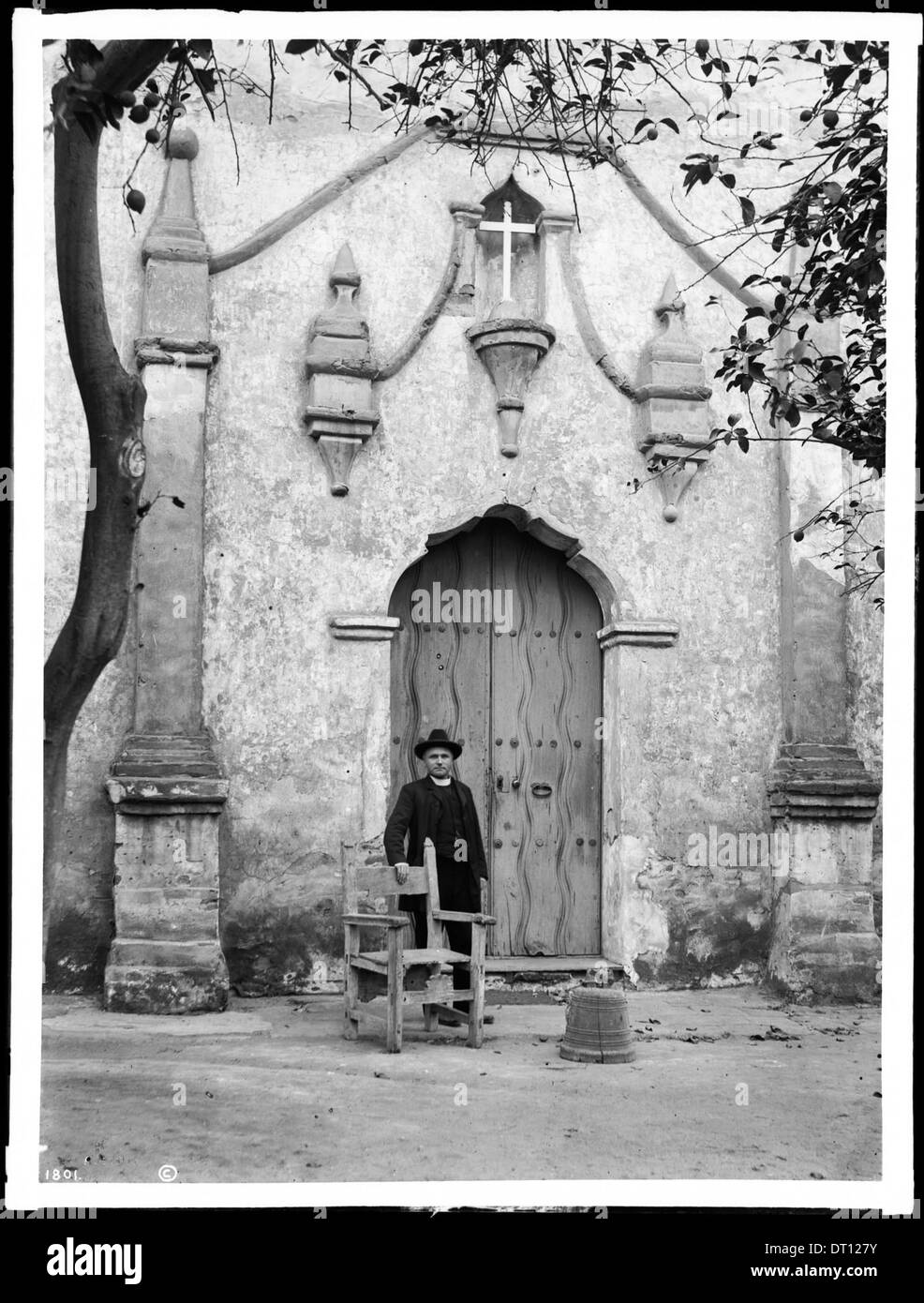 Father Grogan stands at the side door of the Mission San Buenaventura ...
