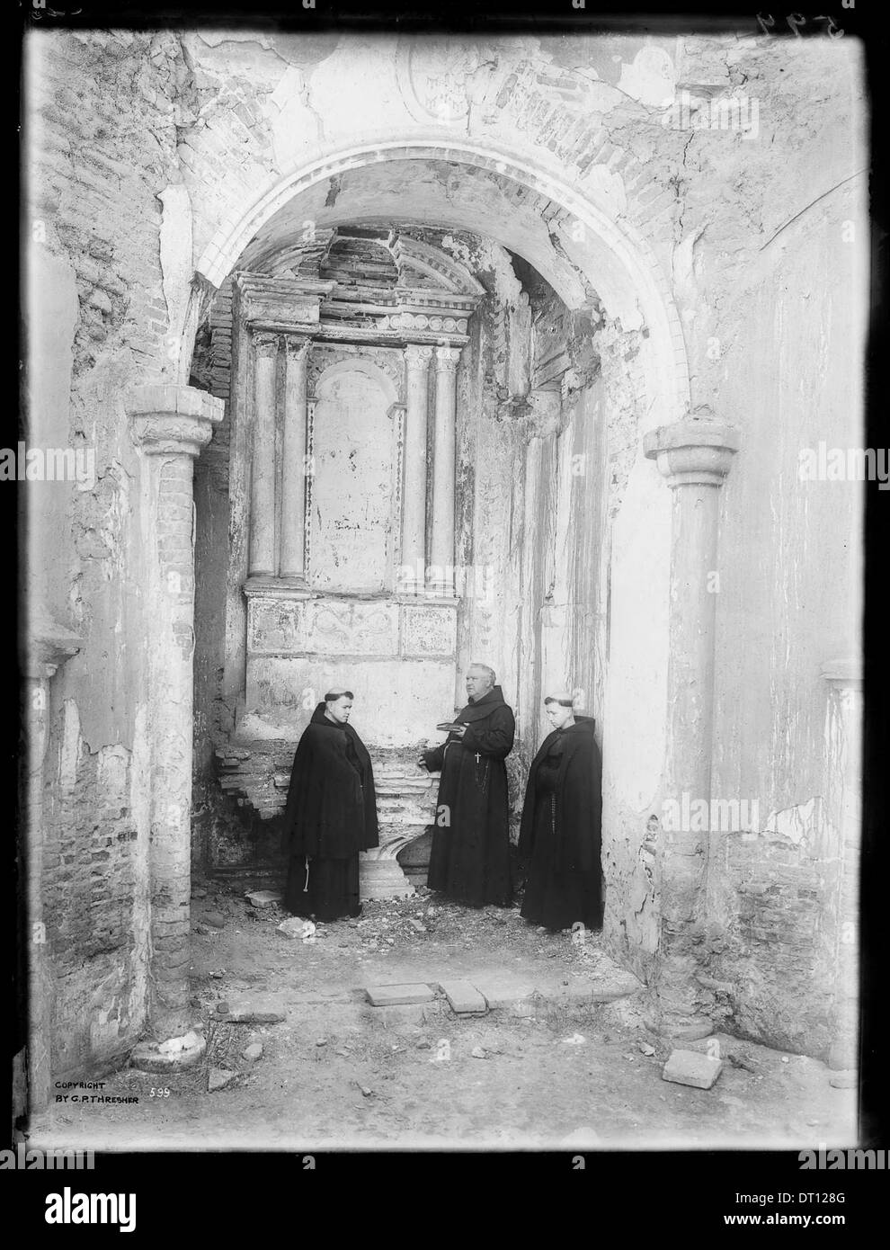 A photograph of Father O'Keefe and two neophyte monks standing at the ...