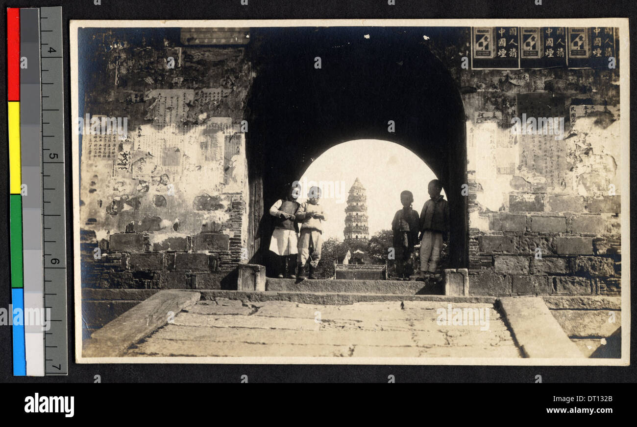 A photograph showing four Chinese boys standing in a gateway in Kuling ...