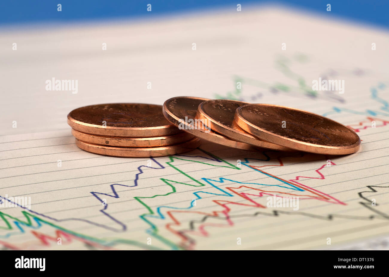Coins on graph Stock Photo - Alamy