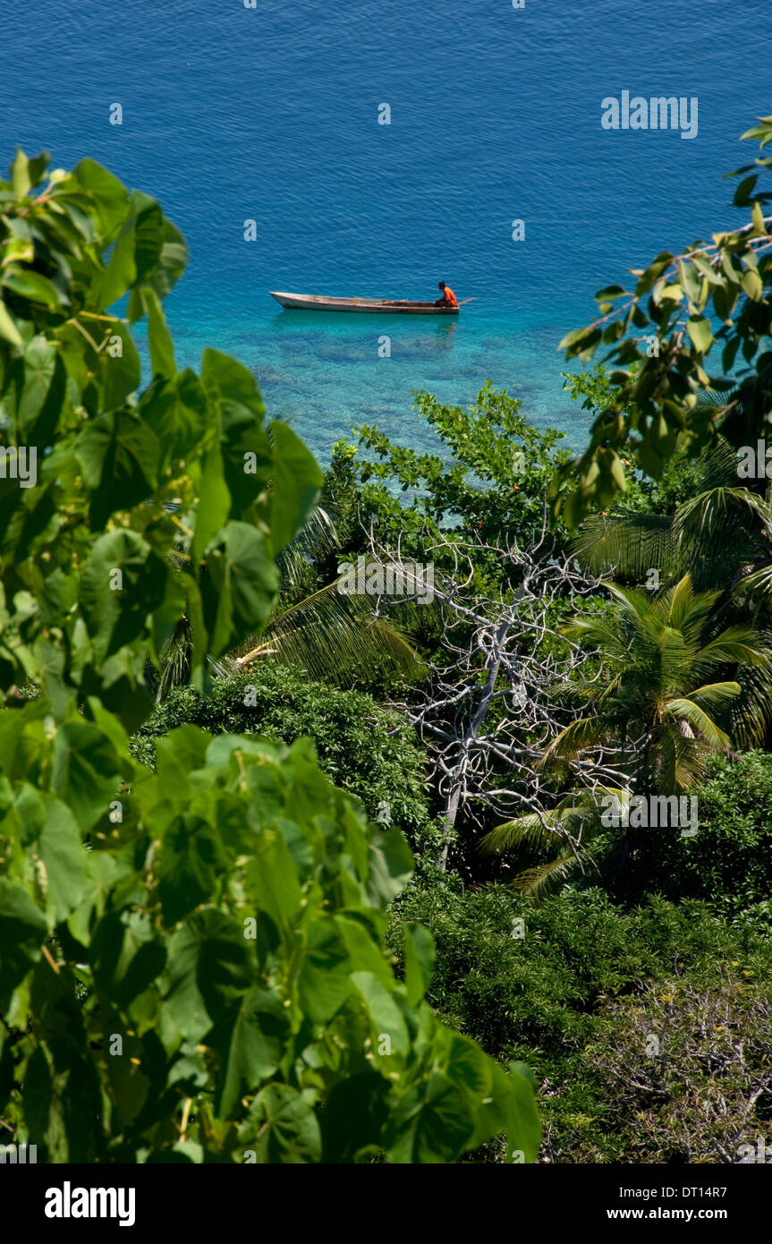 Traditional fishing boat with lush vegetation, Halmahera, Maluku ...