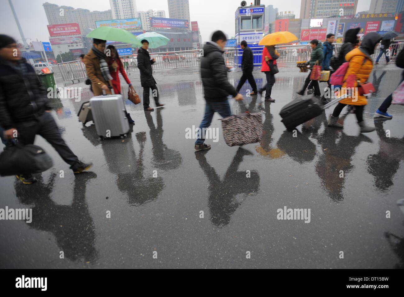 Hefei, China's Anhui Province. 5th Feb, 2014. Passengers walk on the ...
