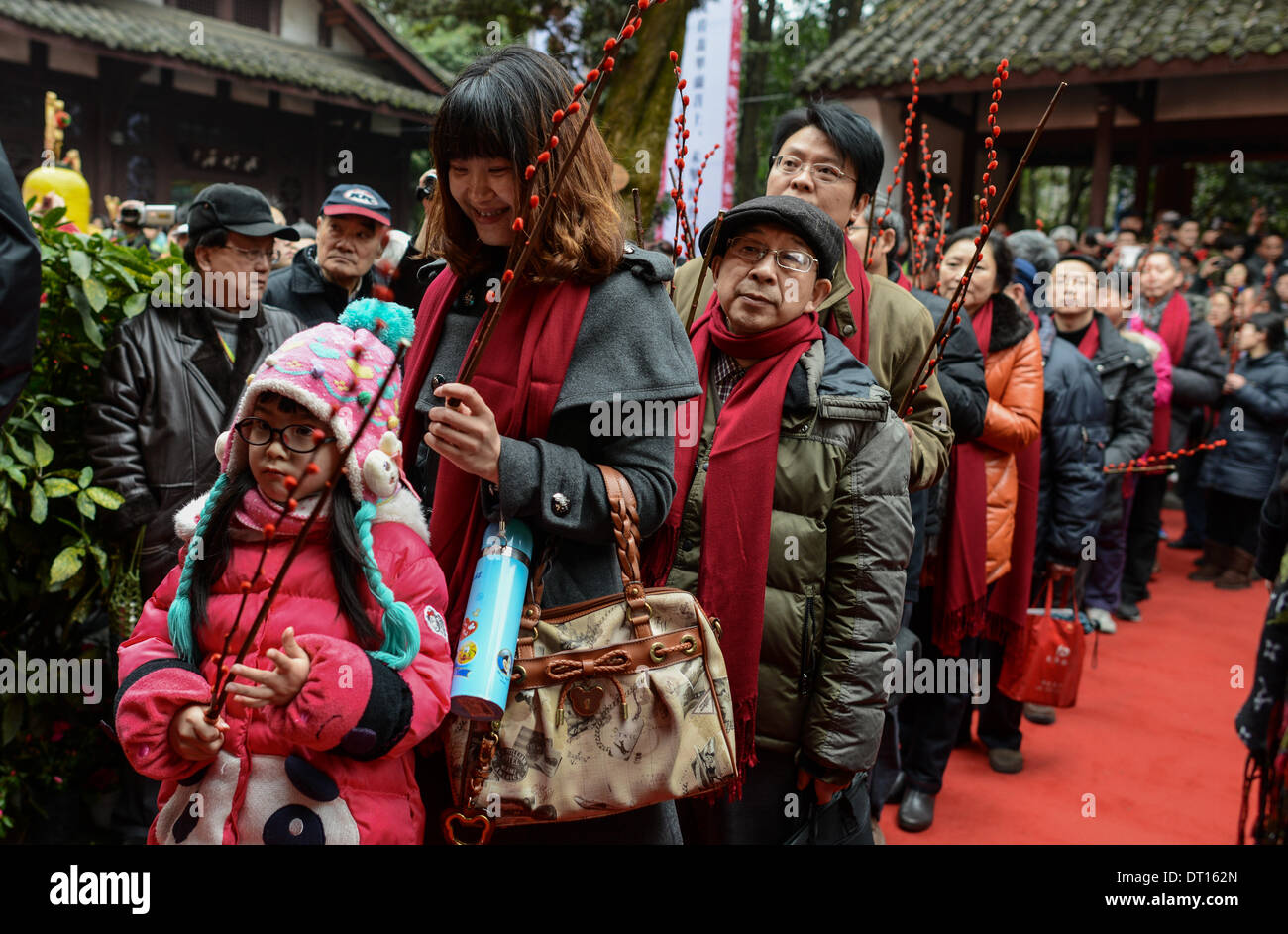 Chengdu, Sichuan, China. 06th Feb, 2014. People wait to present plum ...