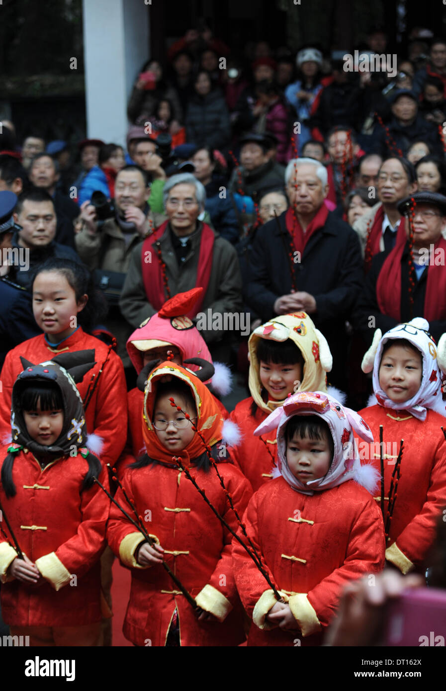 Chengdu, Sichuan, China. 06th Feb, 2014. People wait to present plum ...