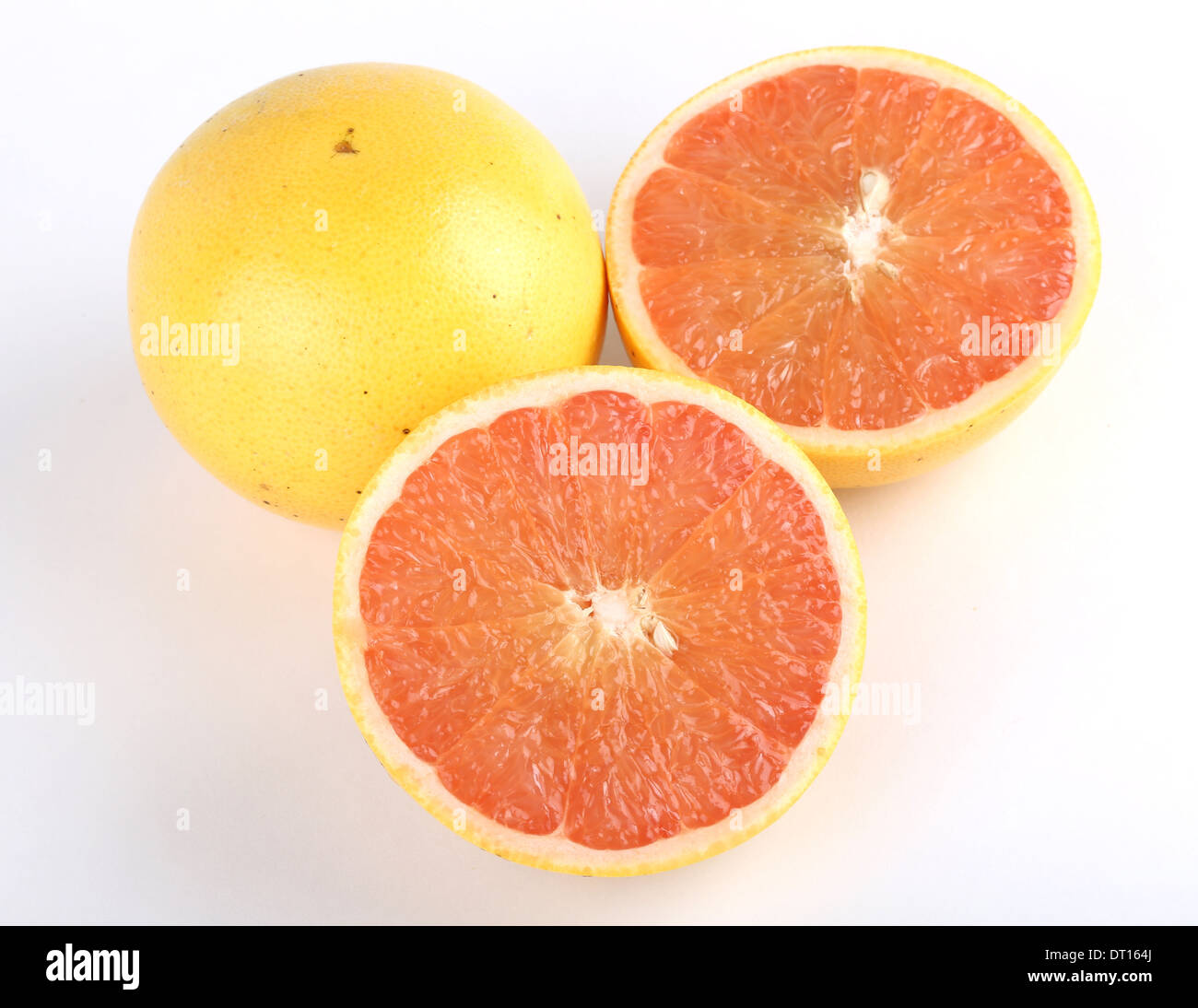 Ripe grapefruit and half isolated on white Stock Photo - Alamy