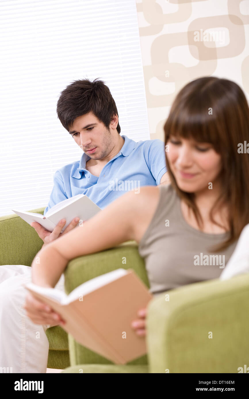 Student - two teenager reading book home Stock Photo - Alamy