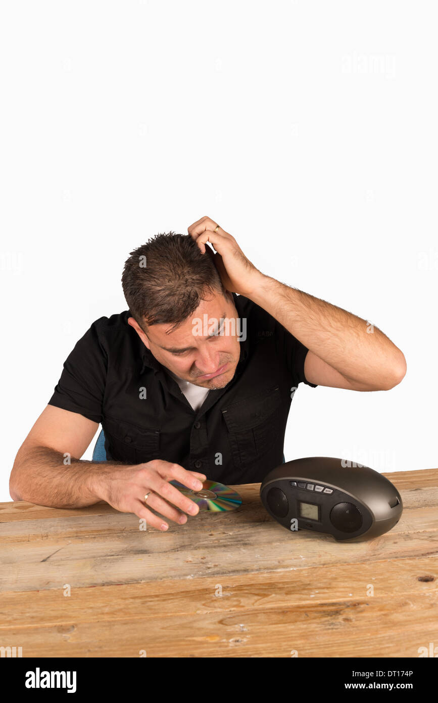 Guy struggling with digital technology, a concept Stock Photo - Alamy