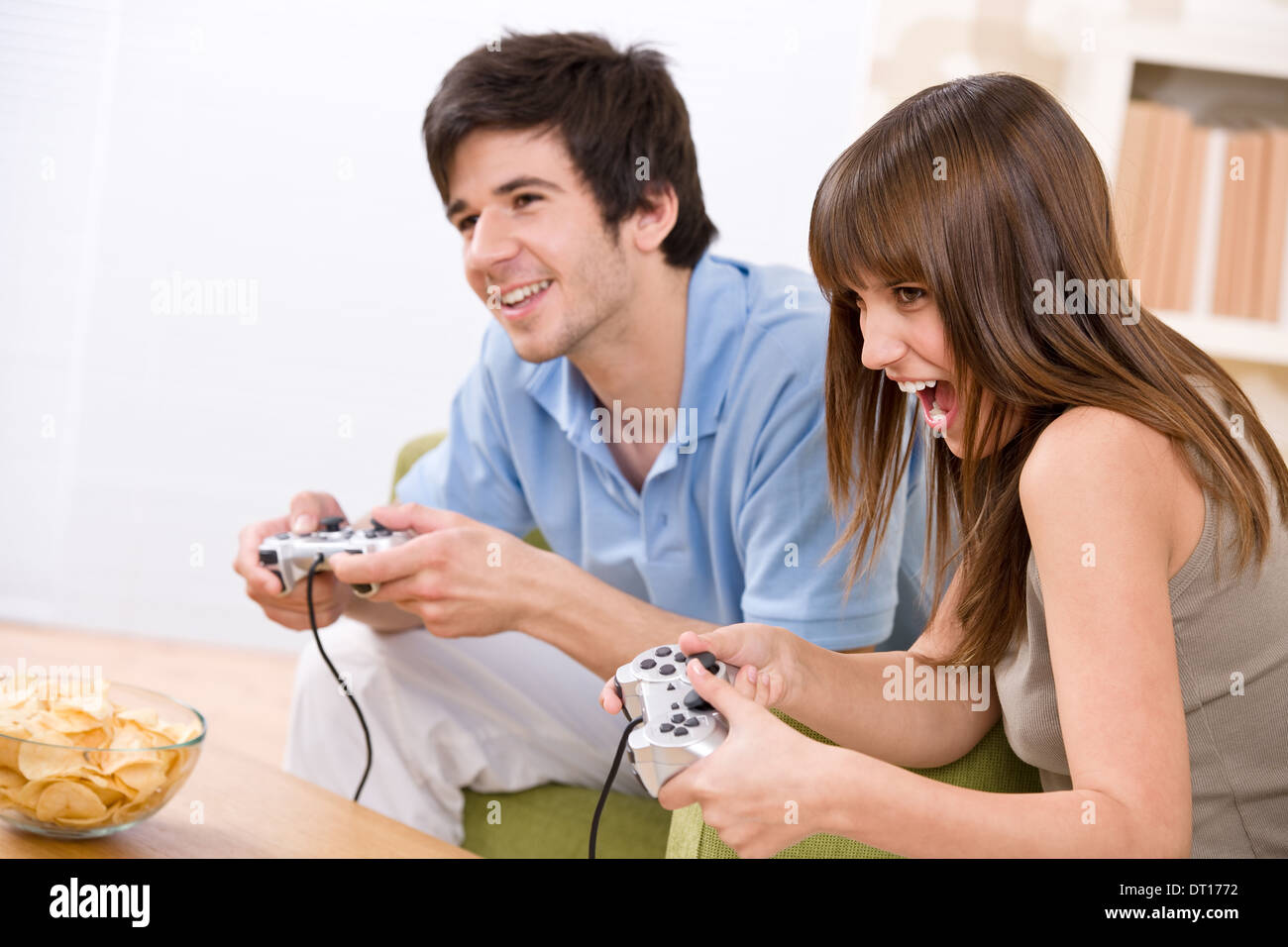 Student - happy teenagers playing video game Stock Photo - Alamy