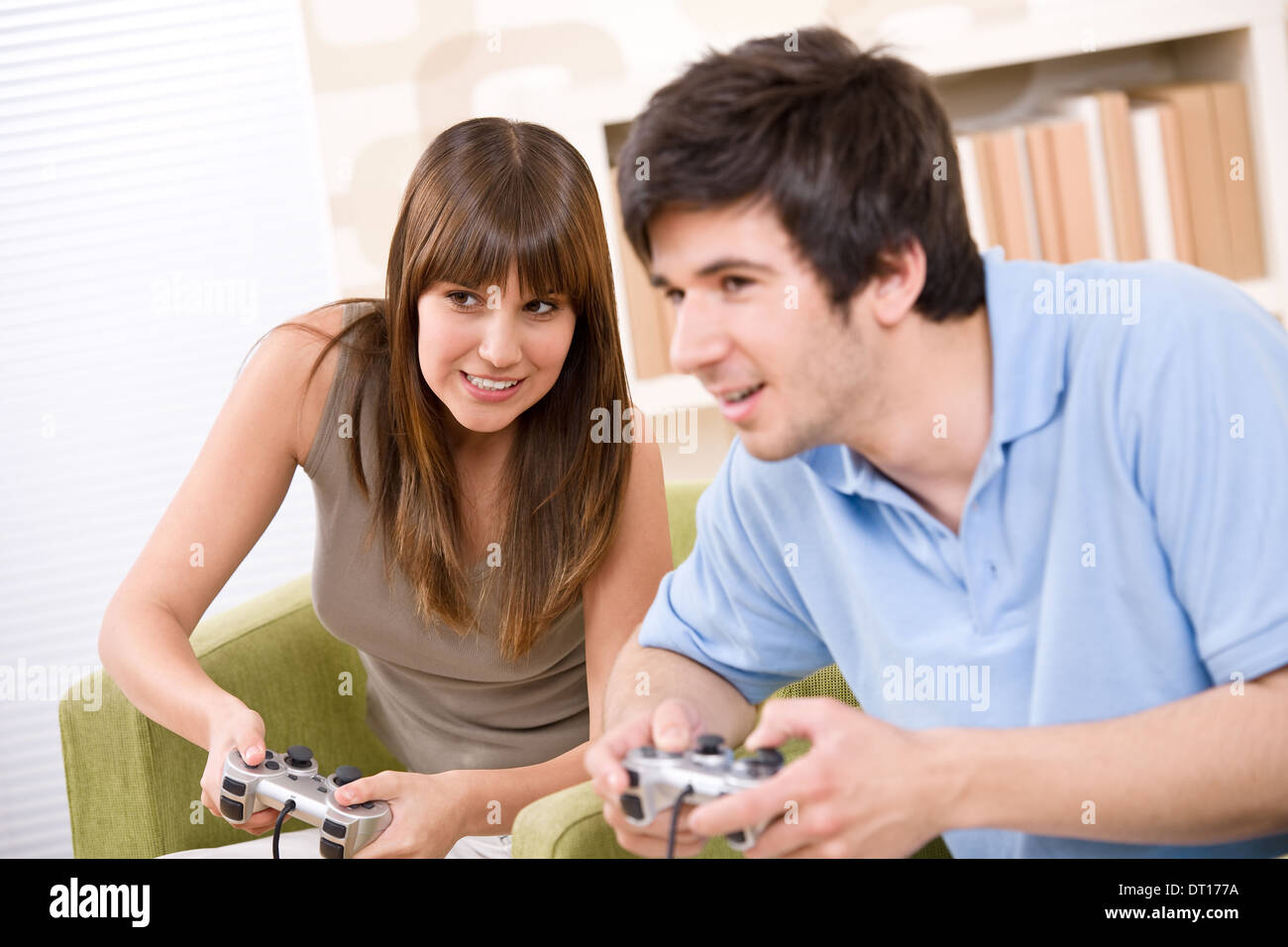 Student - happy teenagers playing video game Stock Photo - Alamy