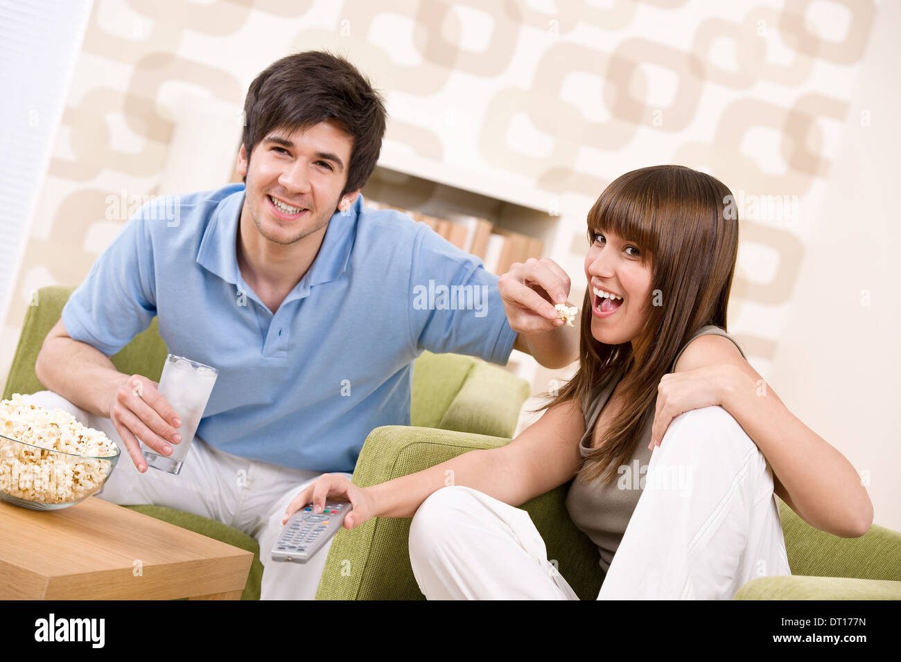 Student - happy teenagers watching television Stock Photo - Alamy