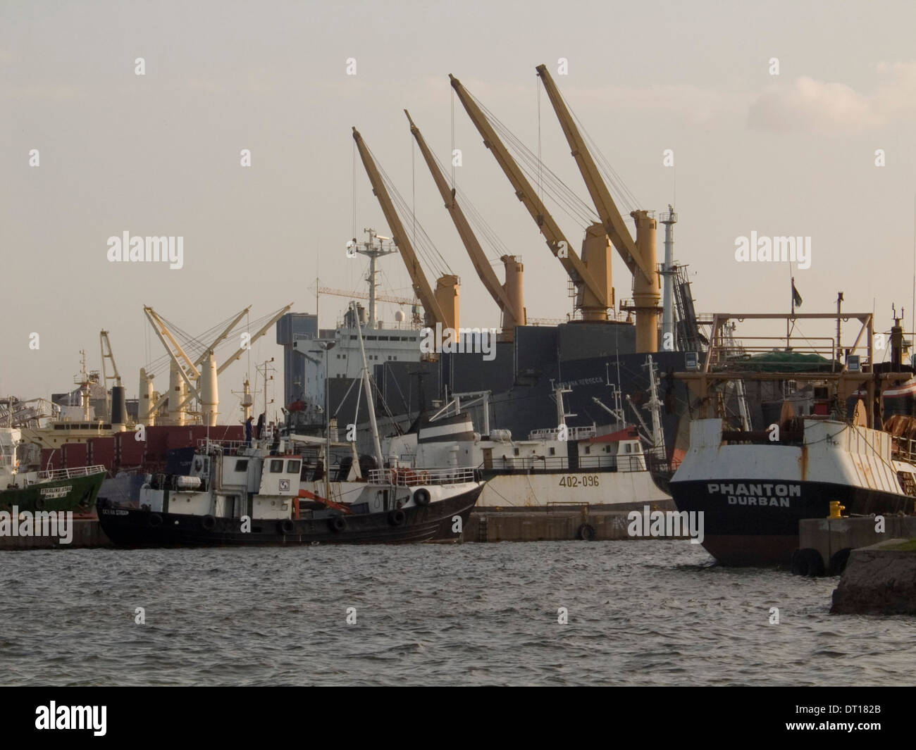 durban harbour sunset, car exports, tugs, ships Stock Photo - Alamy