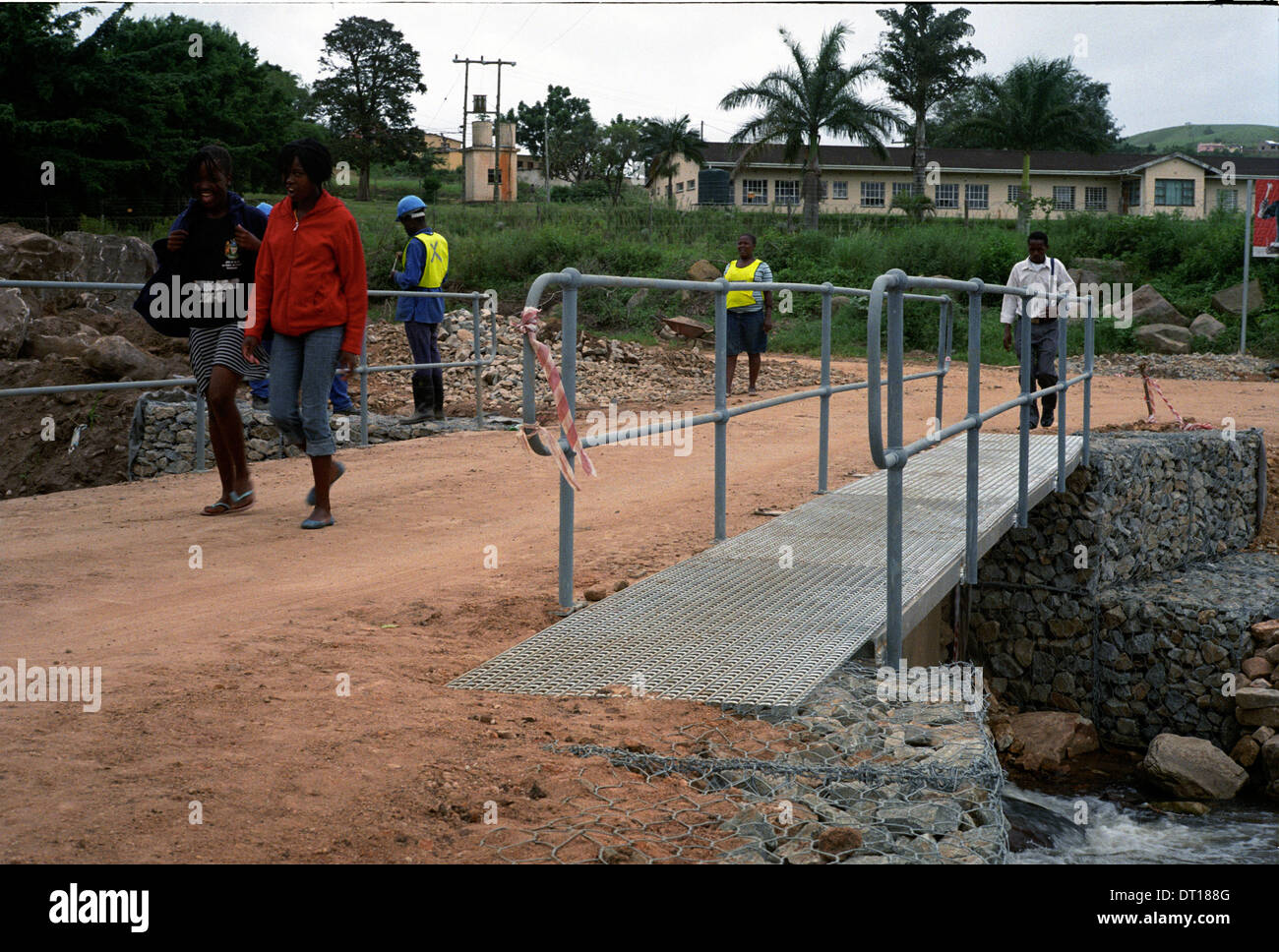 New bridge and walkway over river. Urban and rural development and ...