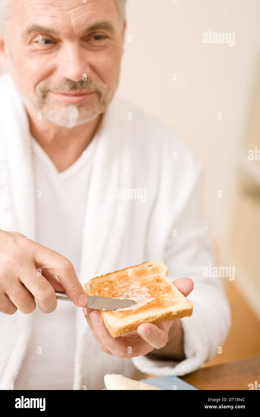 Older man eating toast bread hi-res stock photography and images - Alamy