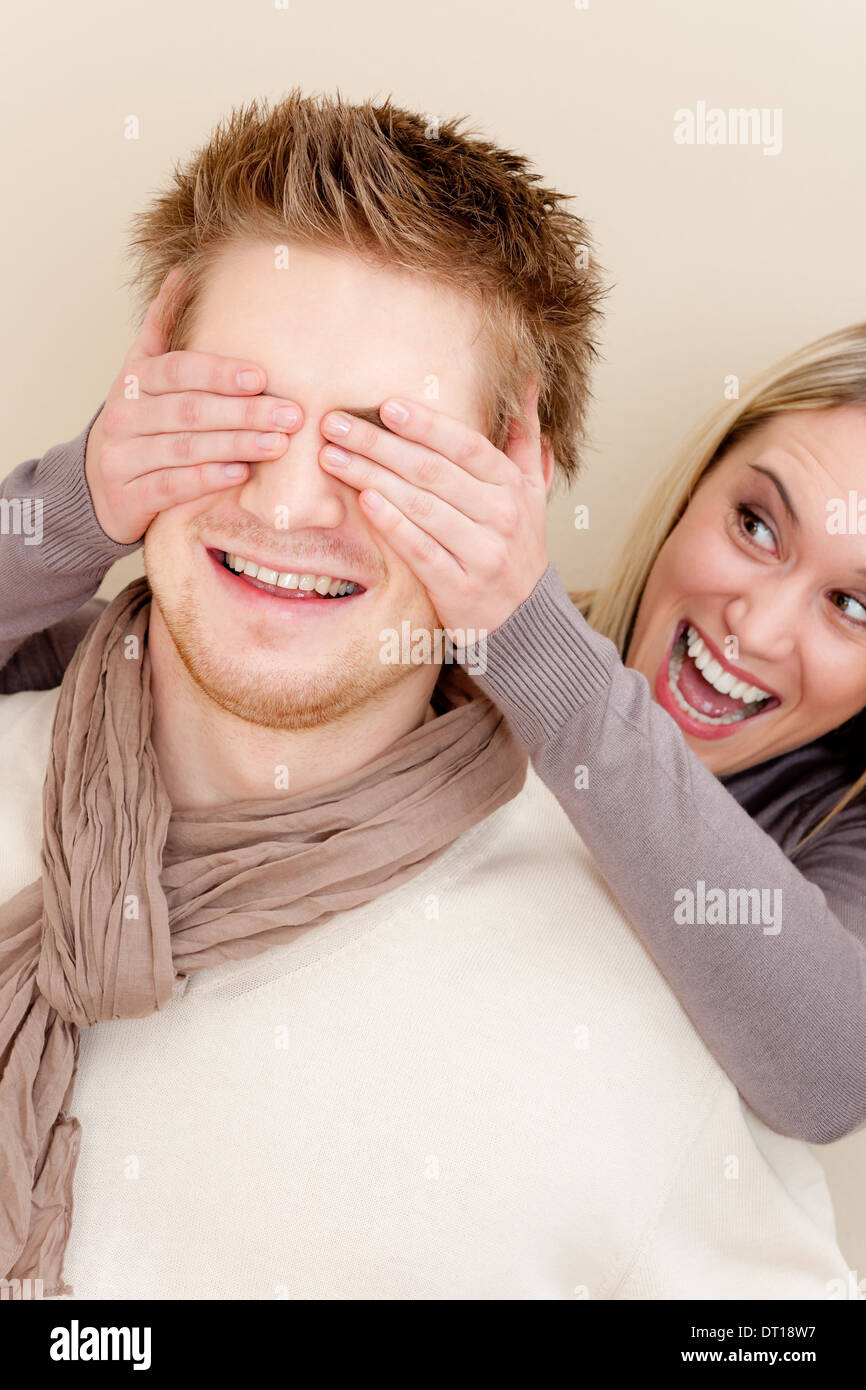 Couple in love - woman cover eyes of man Stock Photo - Alamy