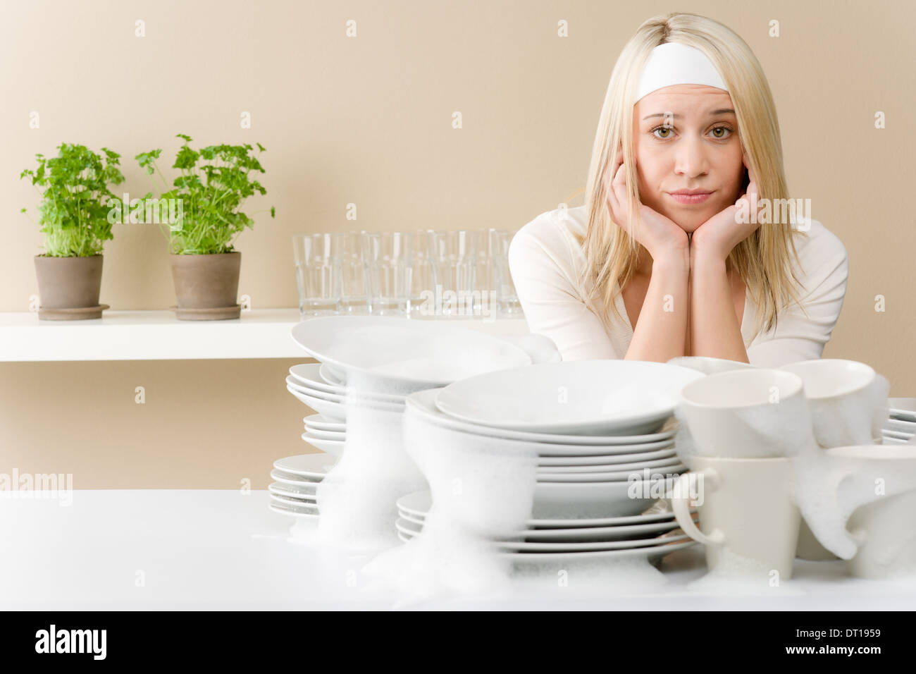 Modern kitchen - frustrated woman in kitchen Stock Photo - Alamy