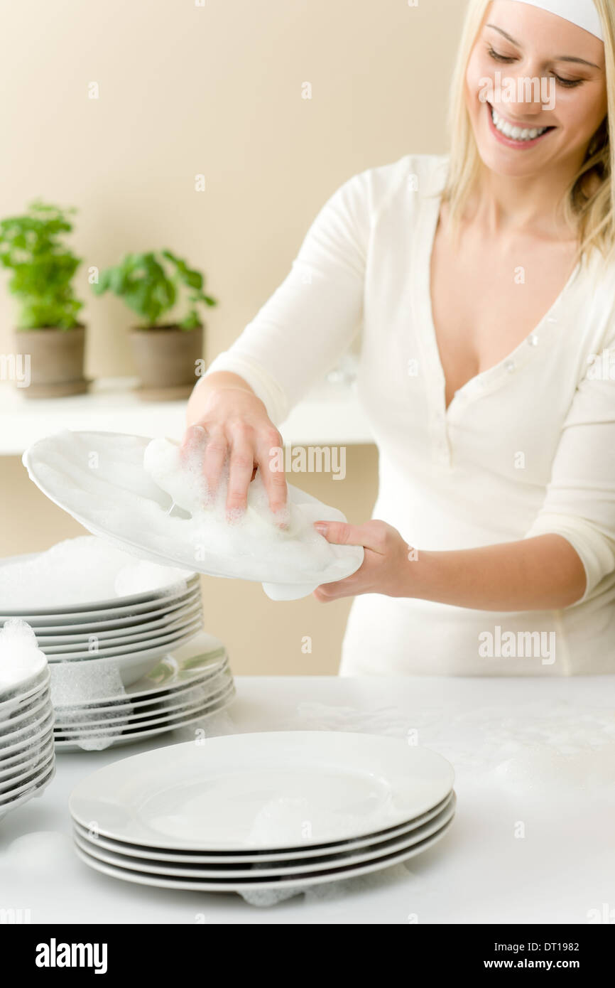 Modern kitchen - happy woman washing dishes Stock Photo - Alamy