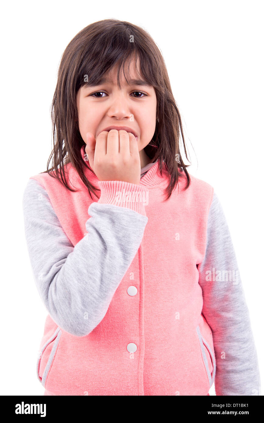 Young girl biting her nails isolated in white Stock Photo - Alamy