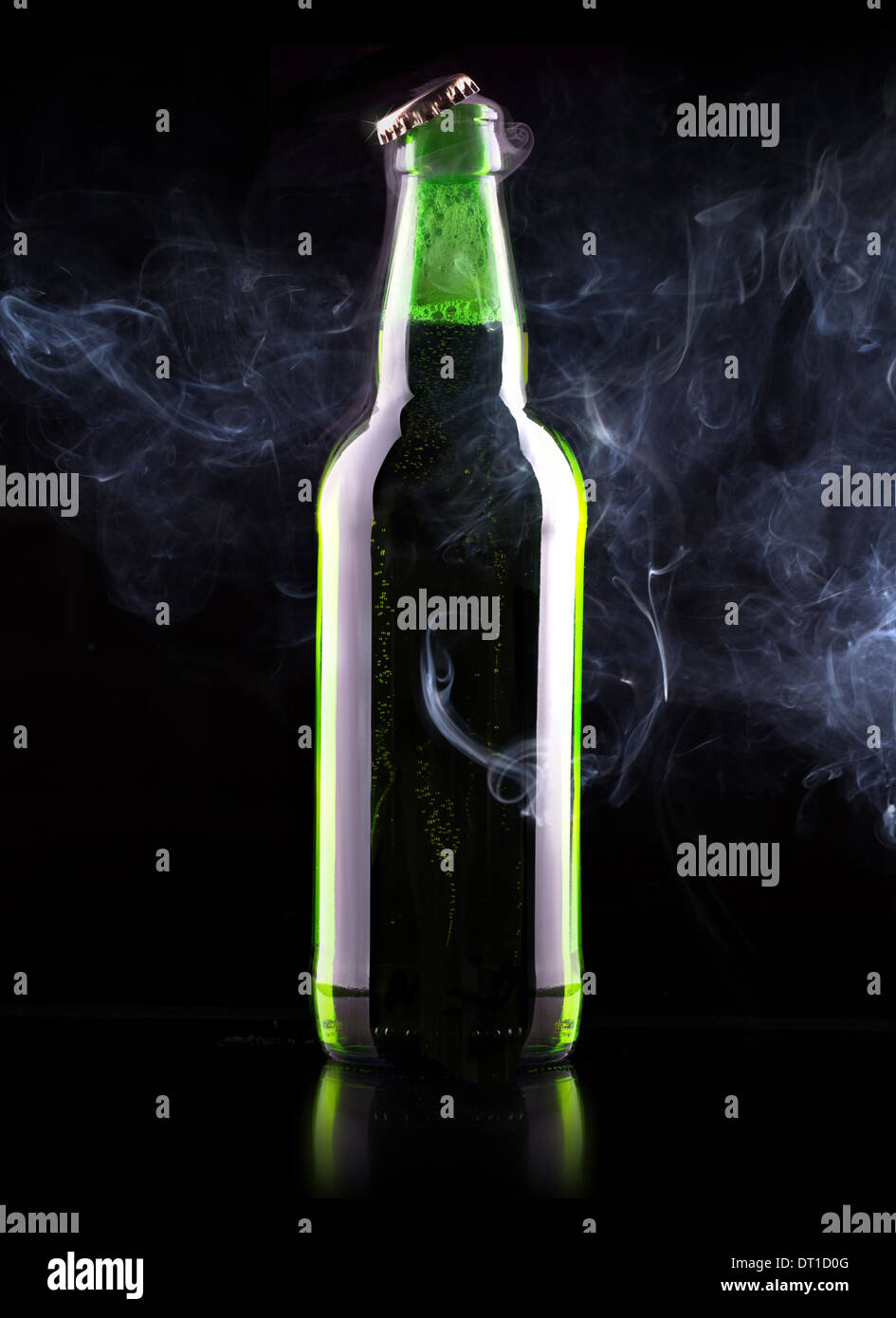 wet Beer bottle with chill smoke on a black Stock Photo - Alamy