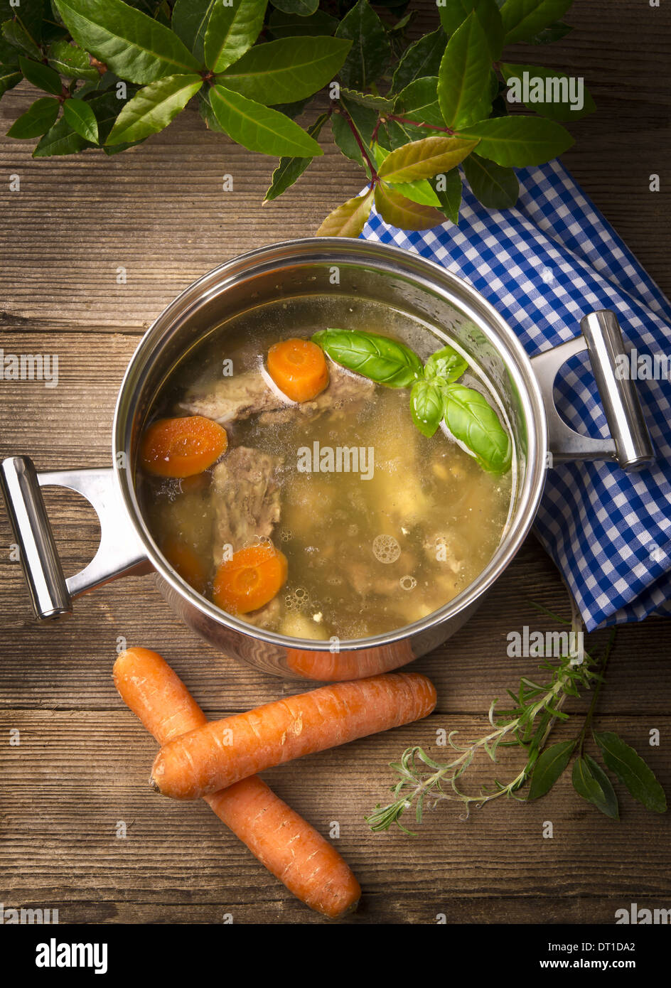 Pot with broth Stock Photo - Alamy