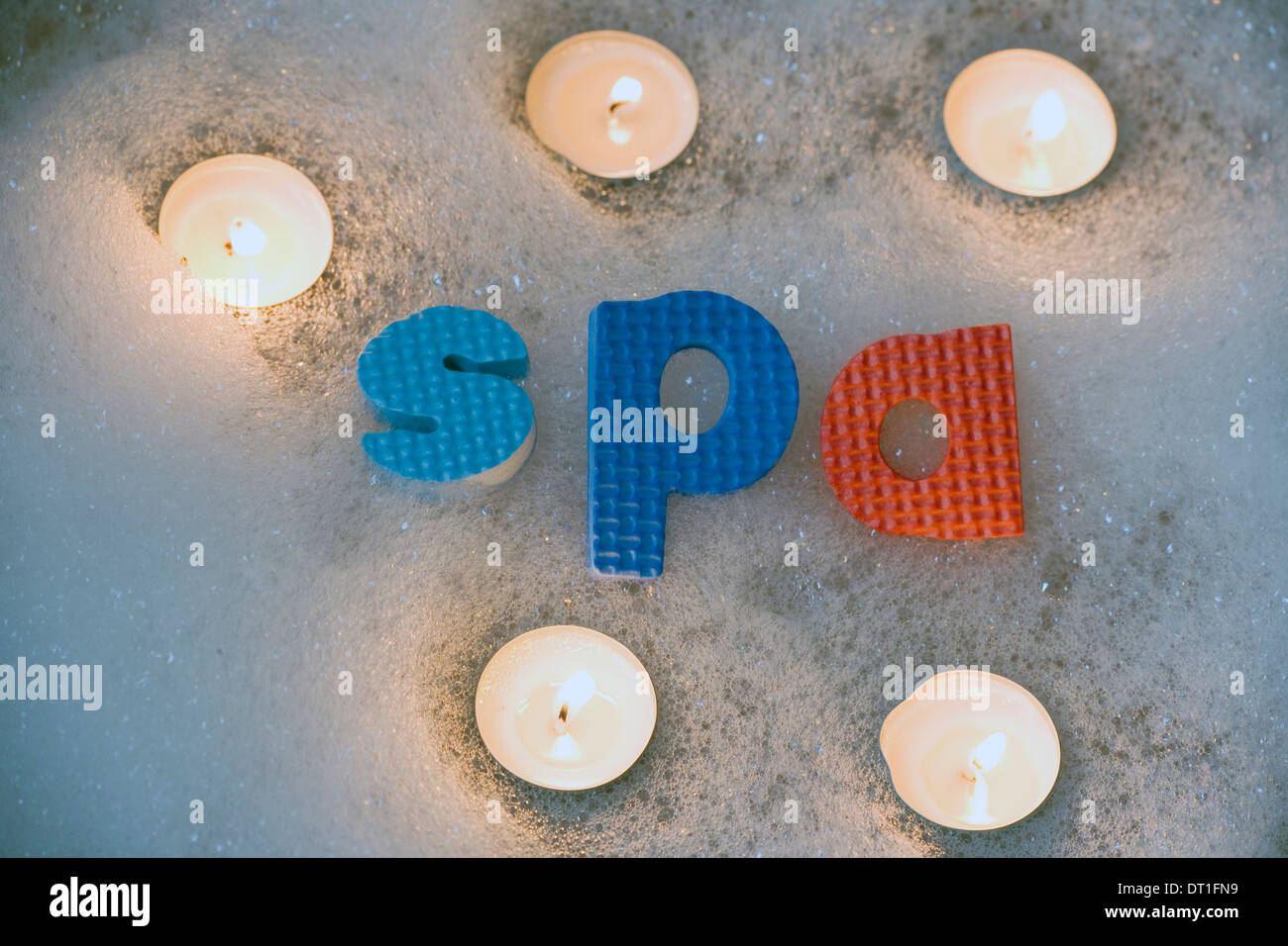 Spa letters with candles abstract Stock Photo - Alamy