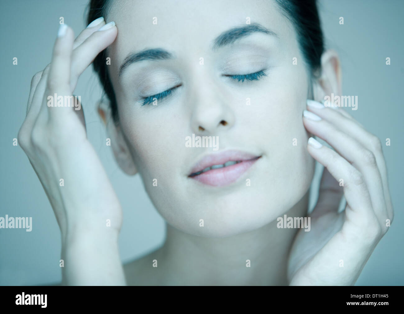Woman touching face, eyes closed, portrait Stock Photo - Alamy
