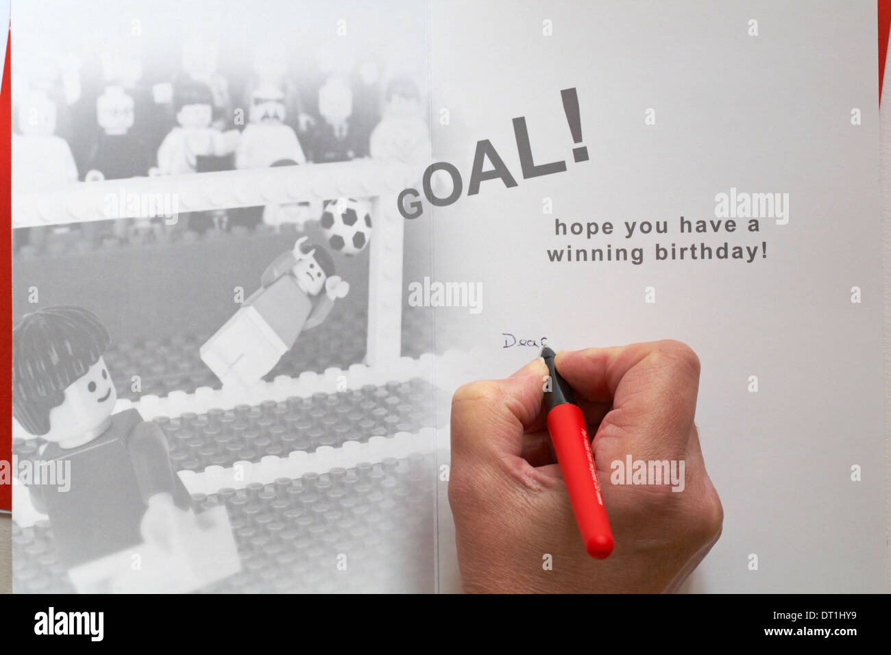 writing in a Birthday card with wording goal hope you have a winning ...