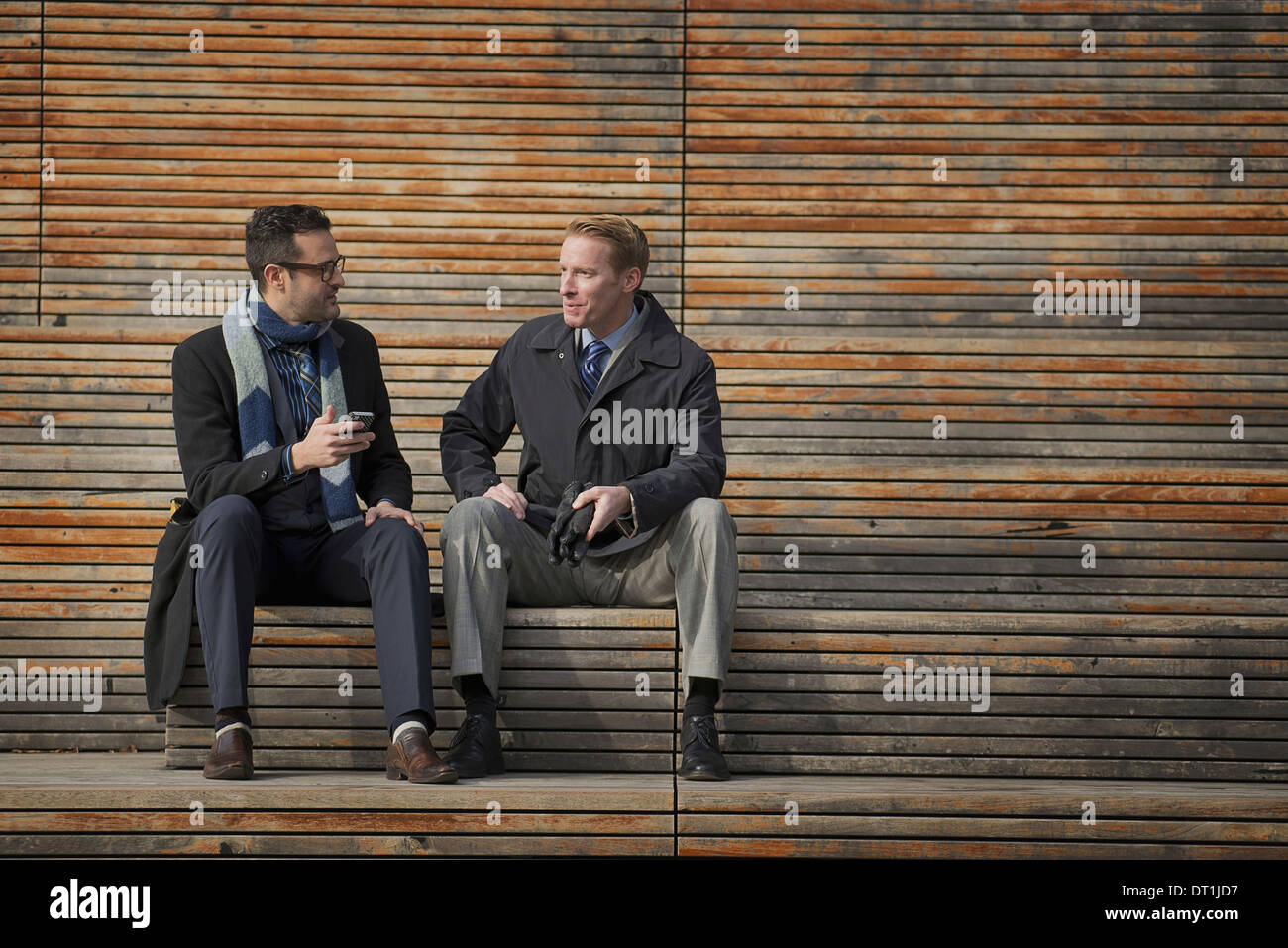 Two men man sitting on a bench hi-res stock photography and images - Alamy