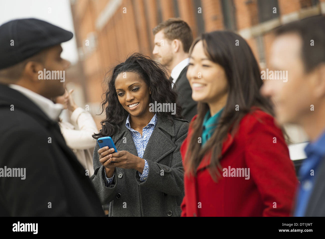 talking to each other Men and women gathering outdoors Five people ...