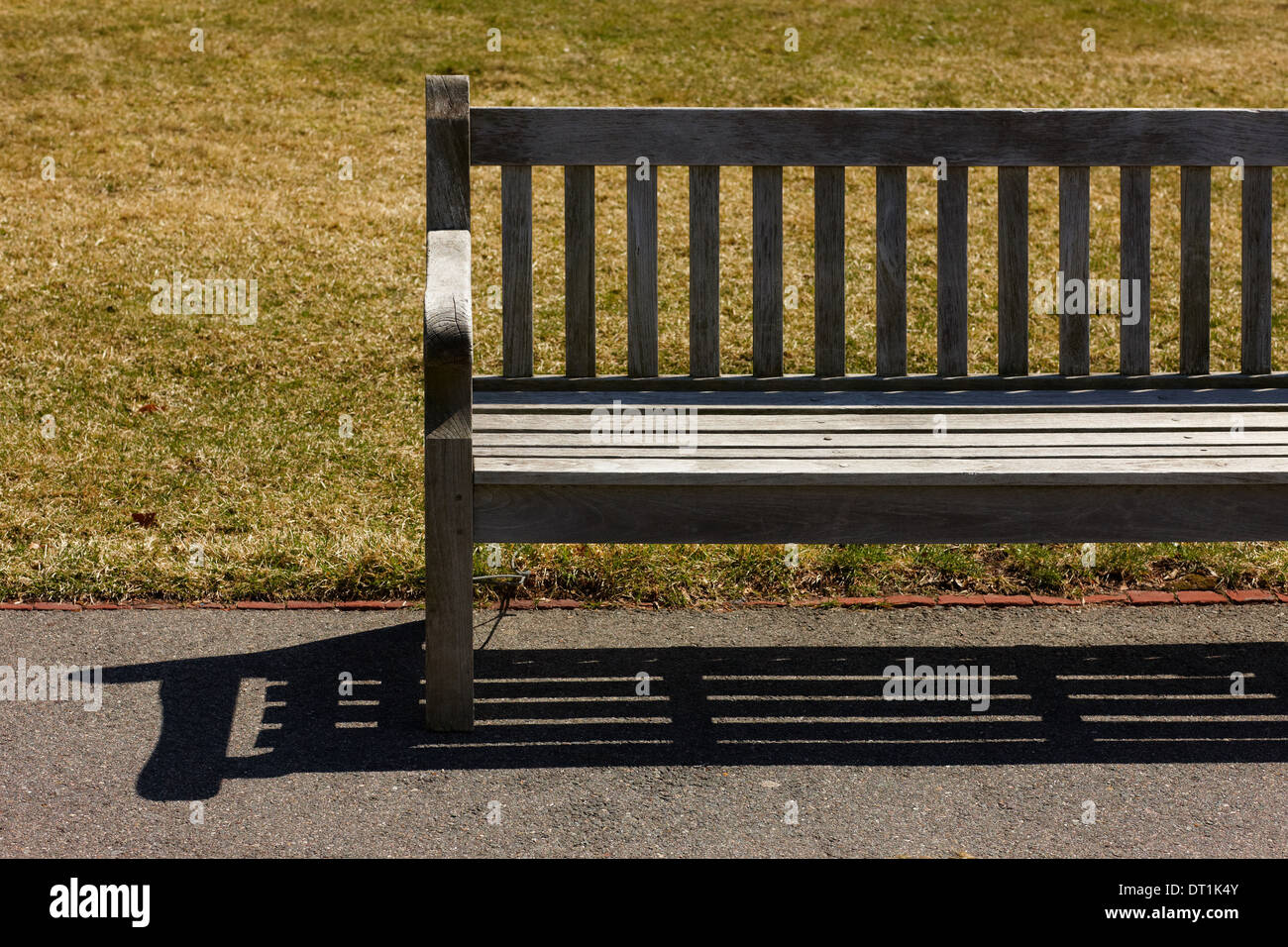 Bench in the green lawn, shadow, road hatch Stock Photo - Alamy