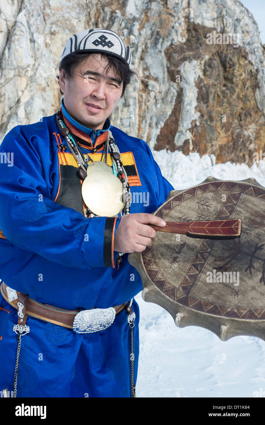 Buryat shaman, Valentin Khagdaev with drum at Olkhon Island celebrating ...