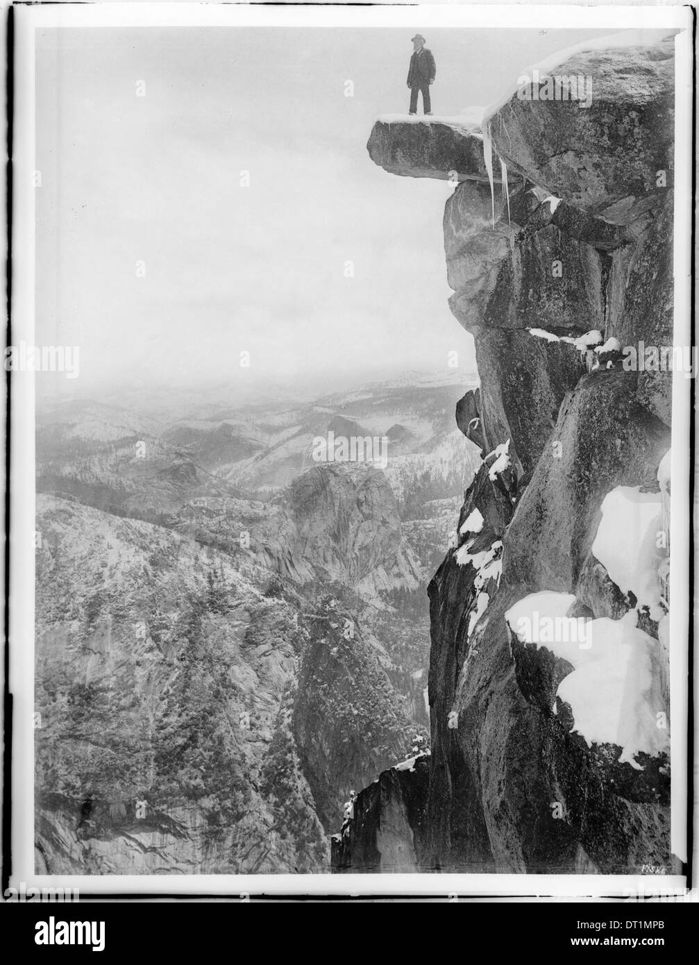 Galen Clark is photographed standing at Glacier Point in Yosemite ...