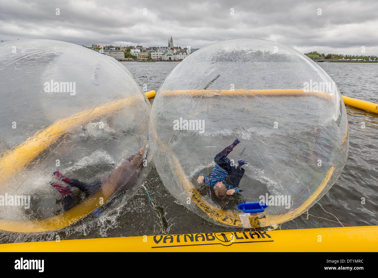 Kids inside water plastic balls on June 17th, Iceland's Independence ...