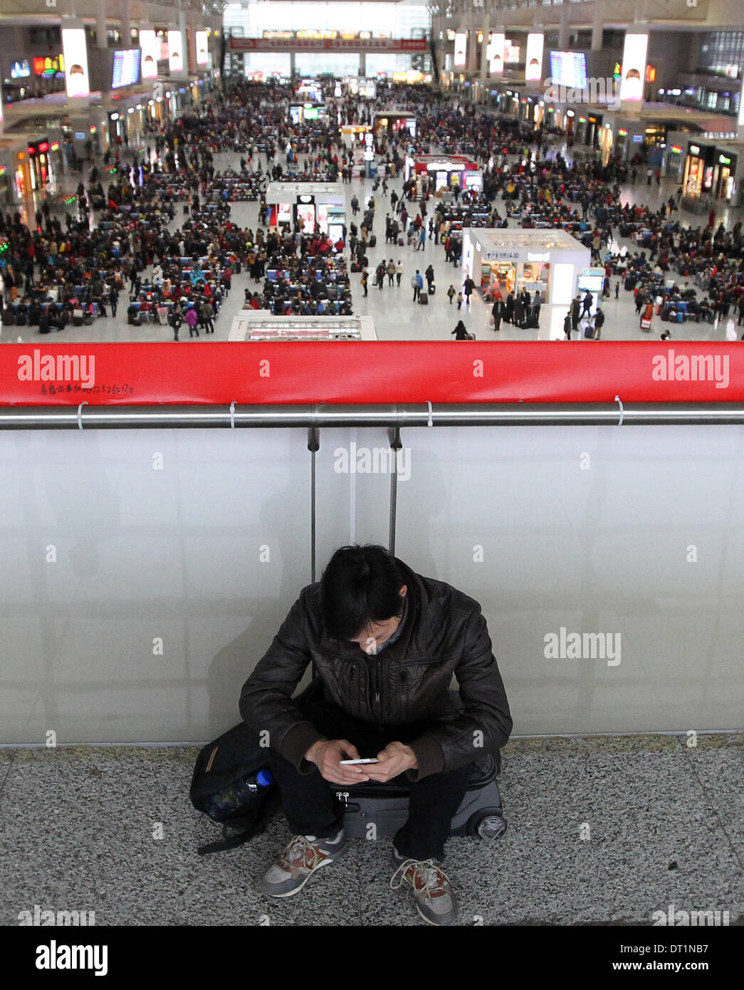 Shanghai, China. 6th Feb, 2014. A passenger has a rest at Shanghai ...