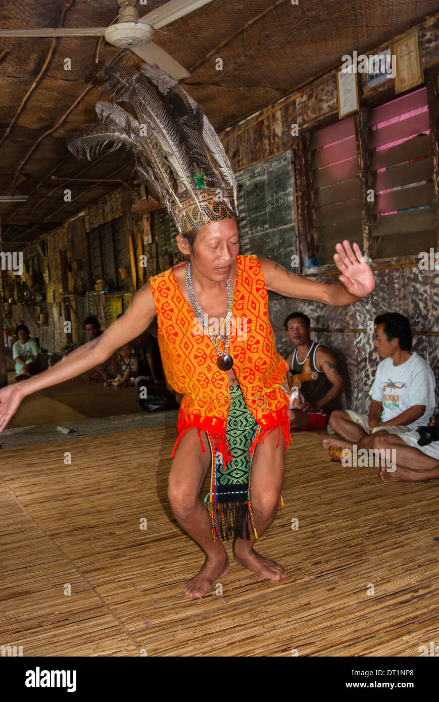 Iban man dancing, Mengkak Iban Longhouse, Batang Ai National Park ...