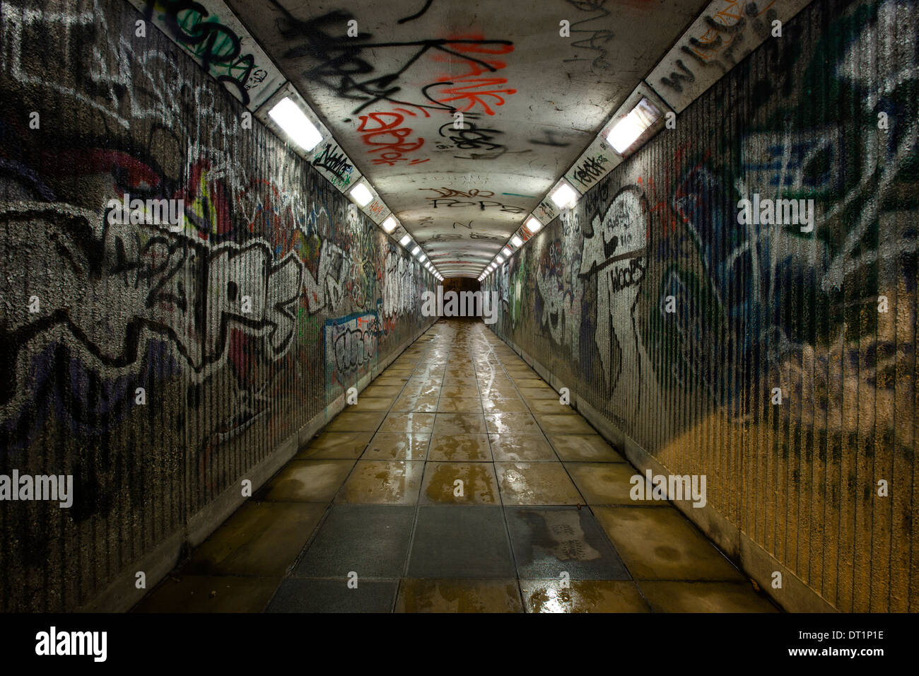Inner city underpass covered in colorful graffiti Stock Photo - Alamy