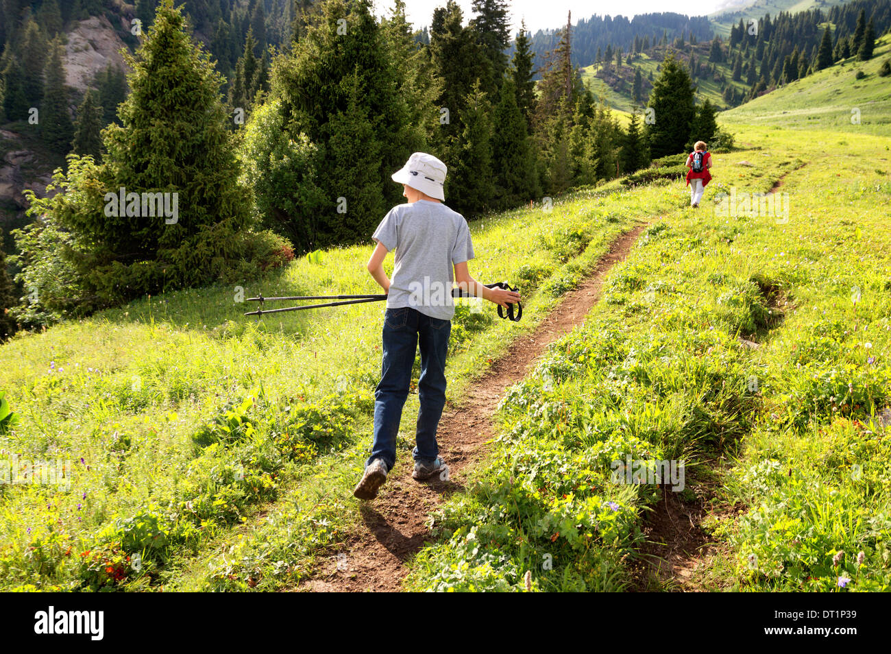 Mother and son walking on the footpath in mountains Stock Photo - Alamy