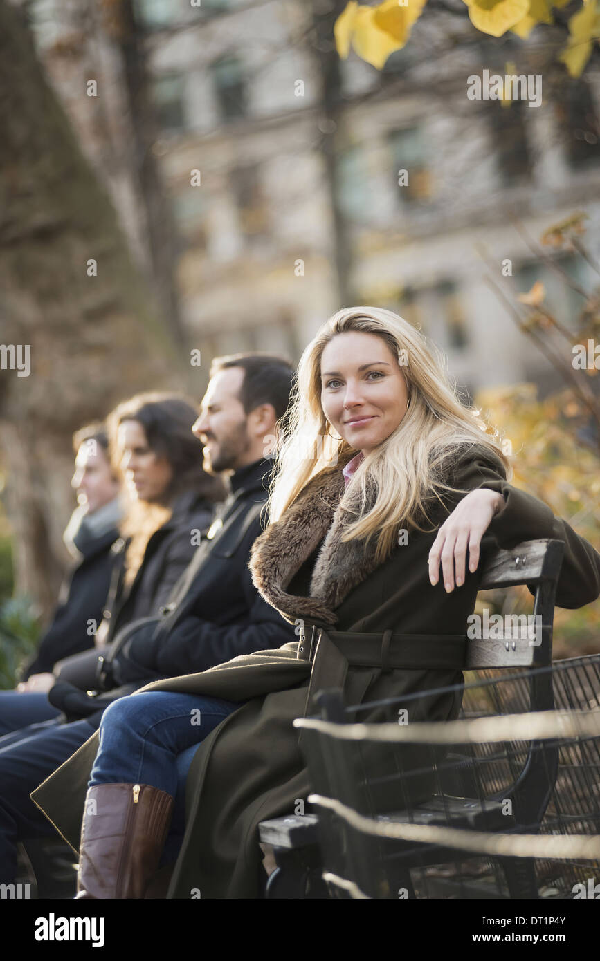 Business people on bench in urban park Stock Photo - Alamy