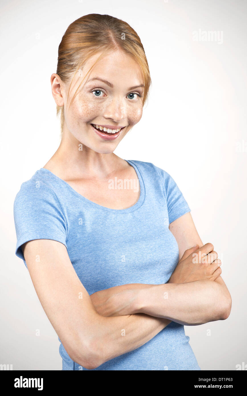 Young woman with arms folded, portrait Stock Photo - Alamy