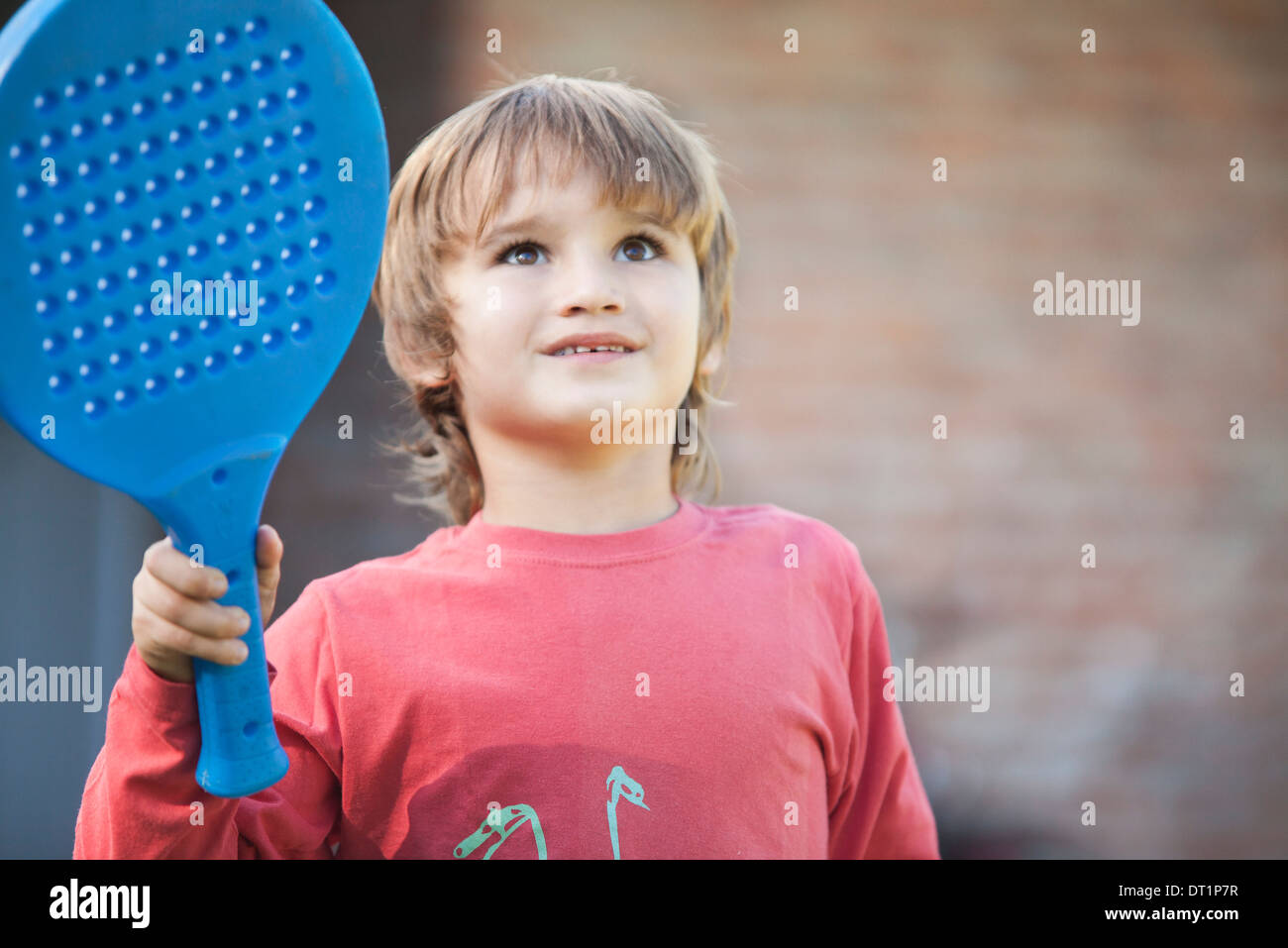 Boy holding racket Stock Photo - Alamy