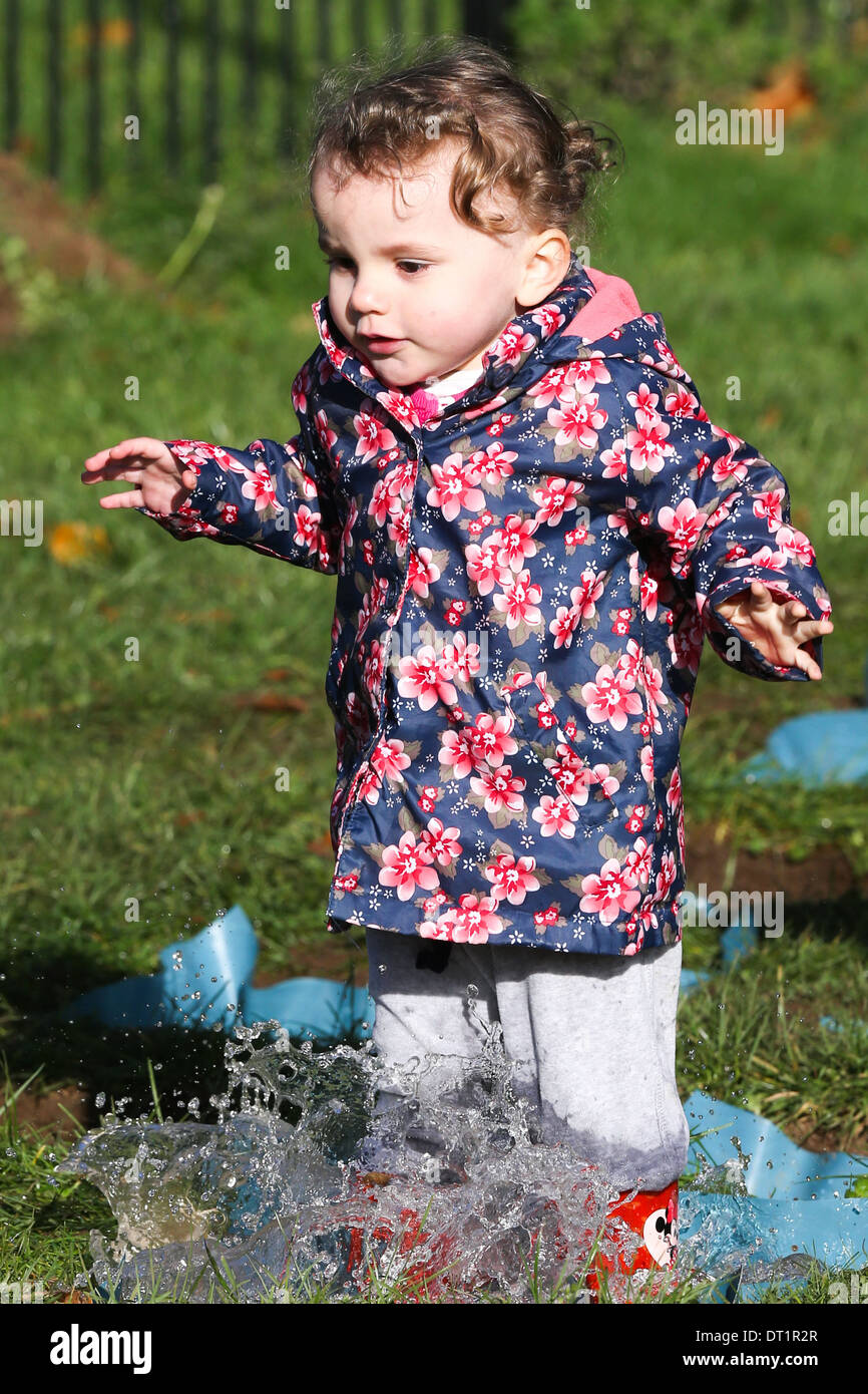 PEOPLE PRACTISING PUDDLE JUMPING TECHNIQUE AT WICKSTEED PARK,KETTERING ...