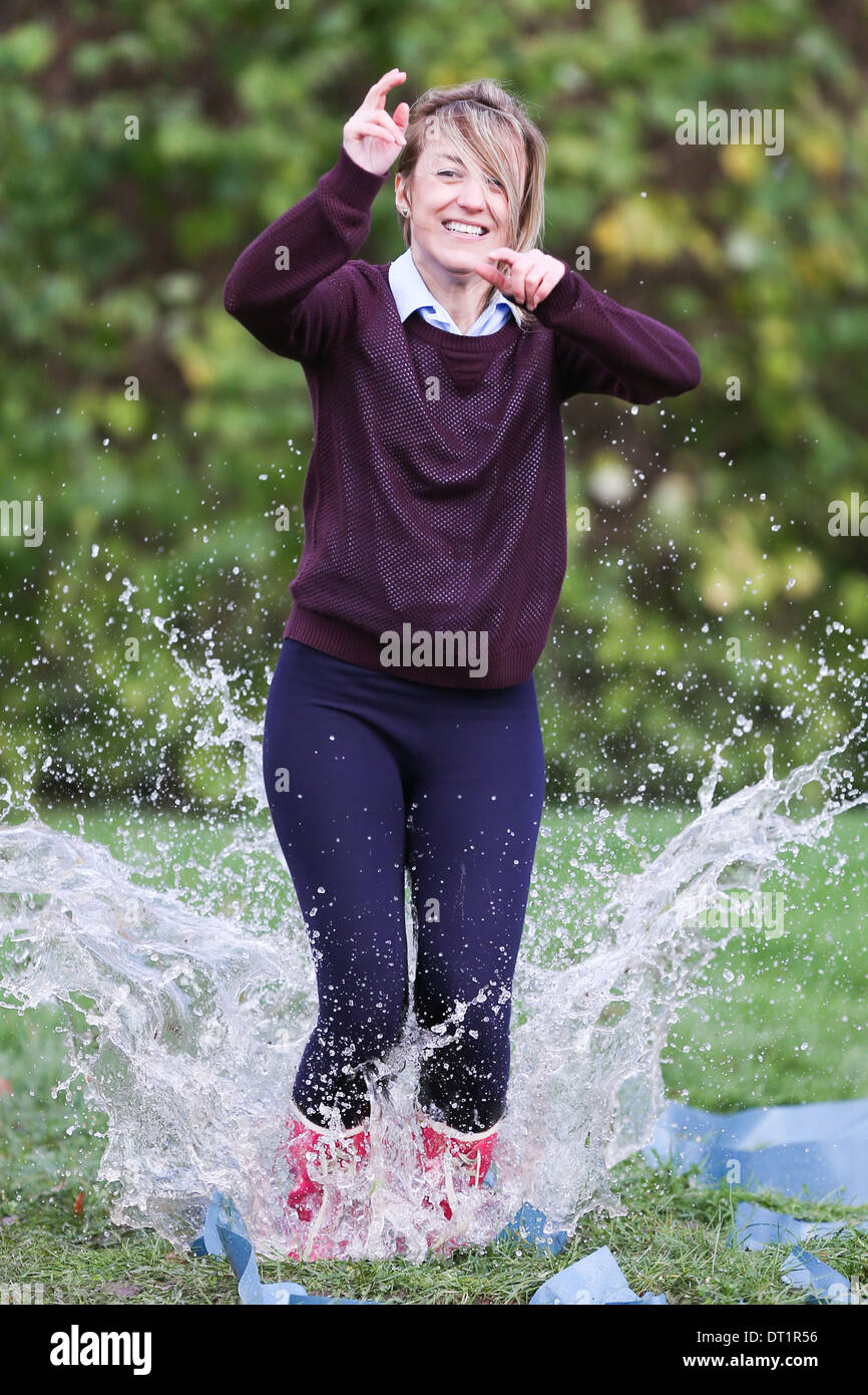Child puddle adult splash hi-res stock photography and images - Alamy
