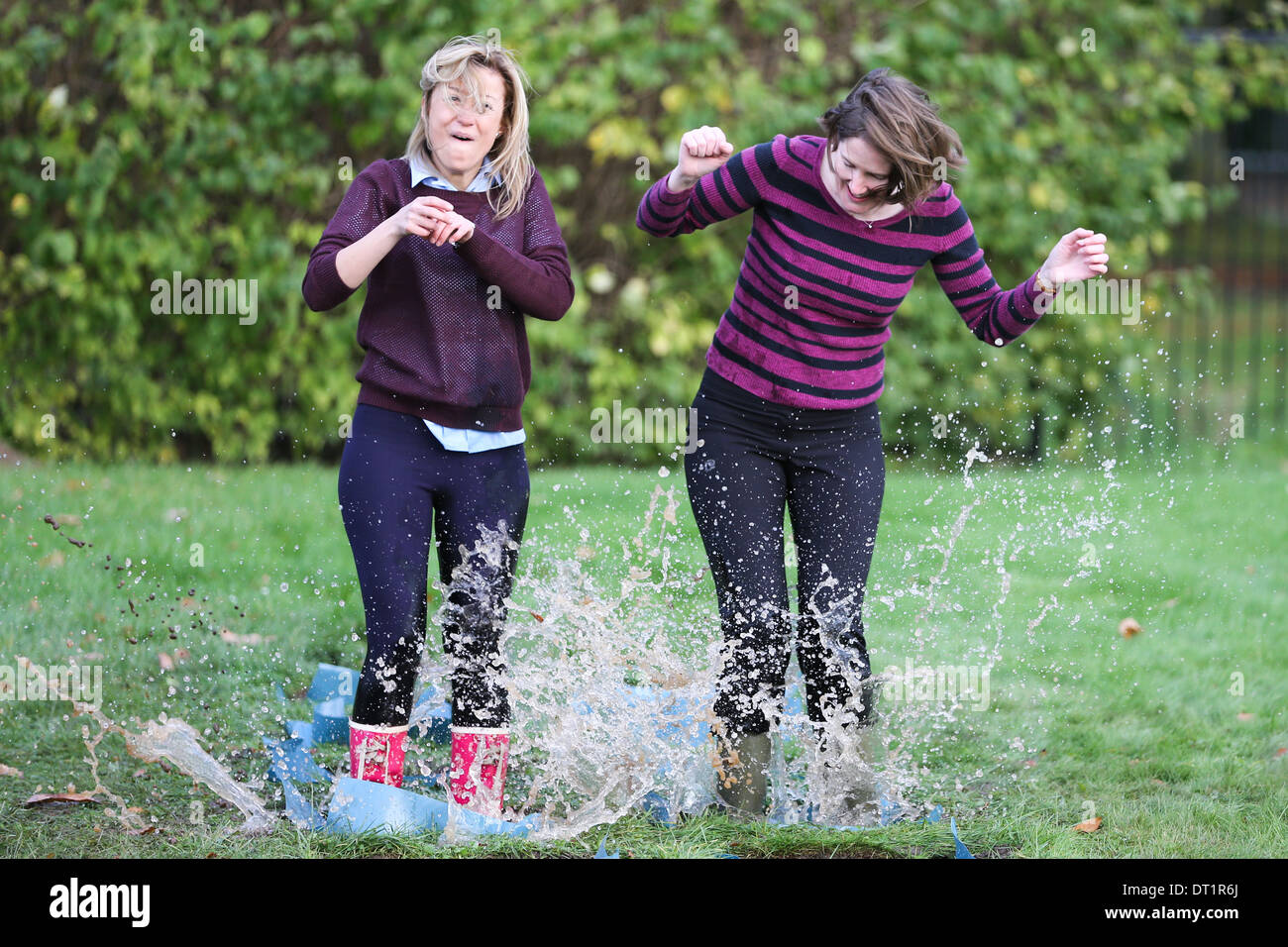 PEOPLE PRACTISING PUDDLE JUMPING TECHNIQUE AT WICKSTEED PARK,KETTERING ...