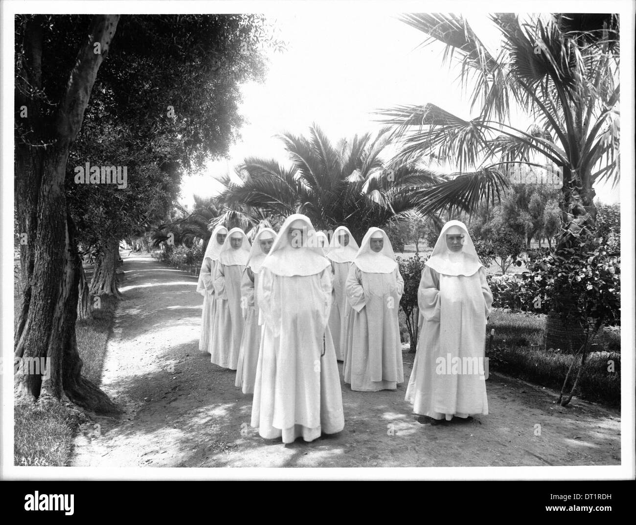 A photograph of a group of eight Dominican sisters processing through ...