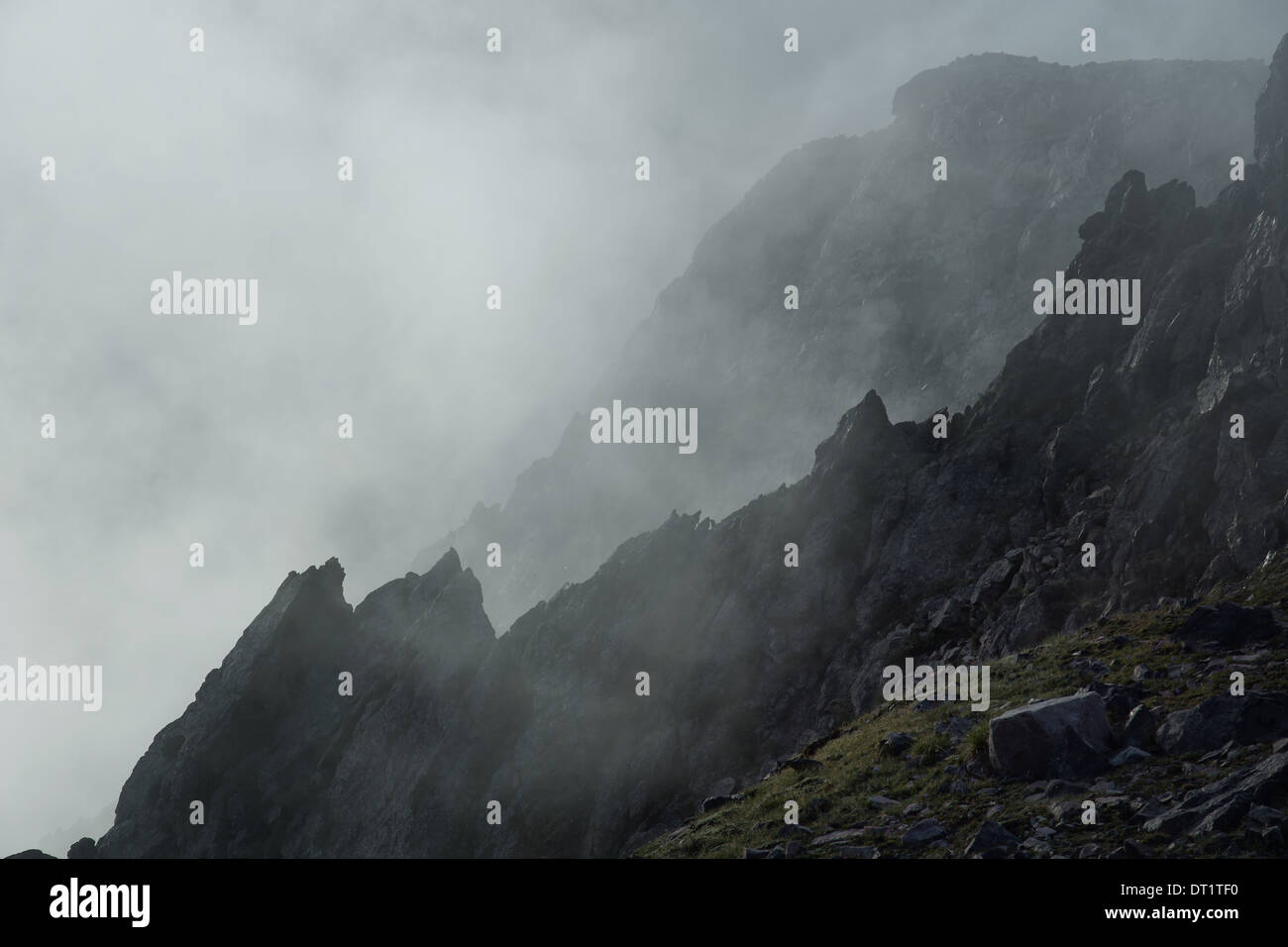 Dramatic clouds and fog in high mountains Stock Photo - Alamy