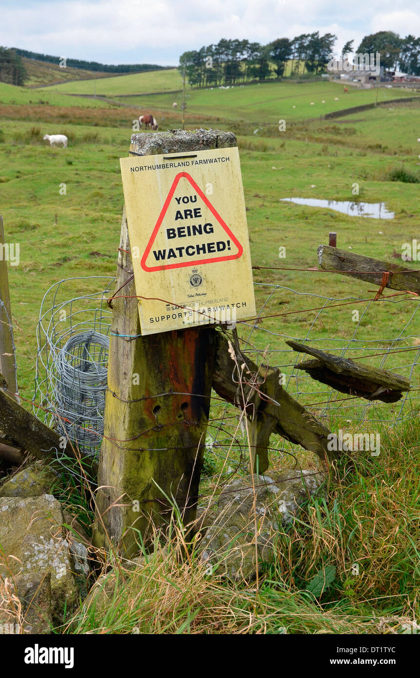 You are being watched. Northumberland Farmwatch sign Stock Photo - Alamy