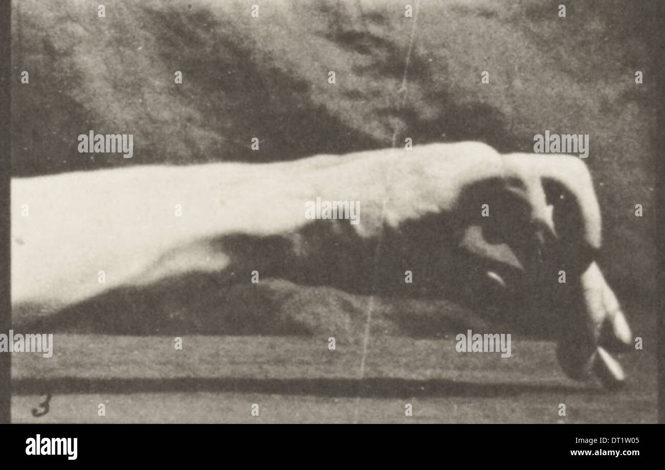 A photograph of a hand drawing a circle, focusing on the hand's ...