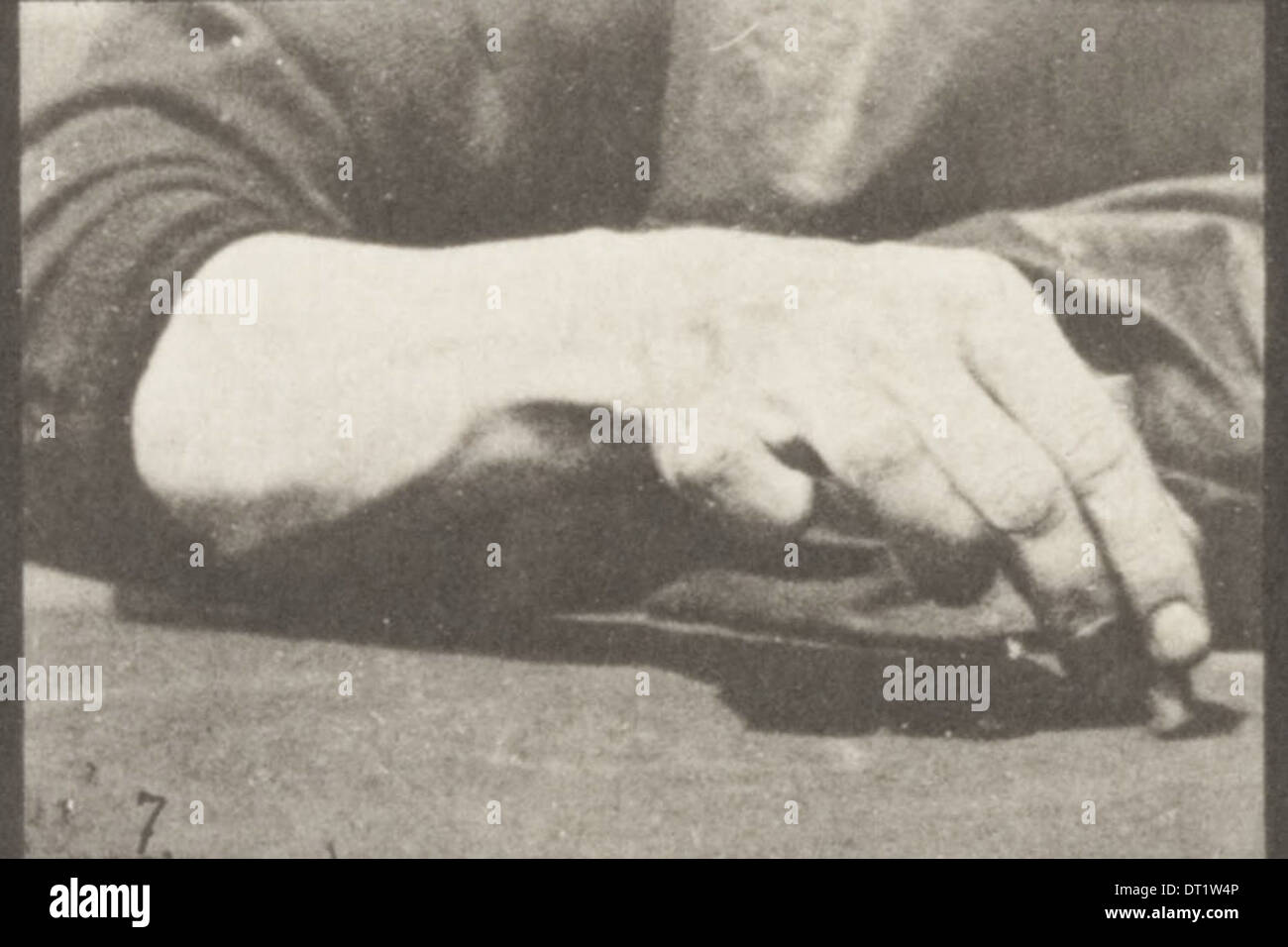 A photograph of a hand drawing a circle, captured in a simple and ...