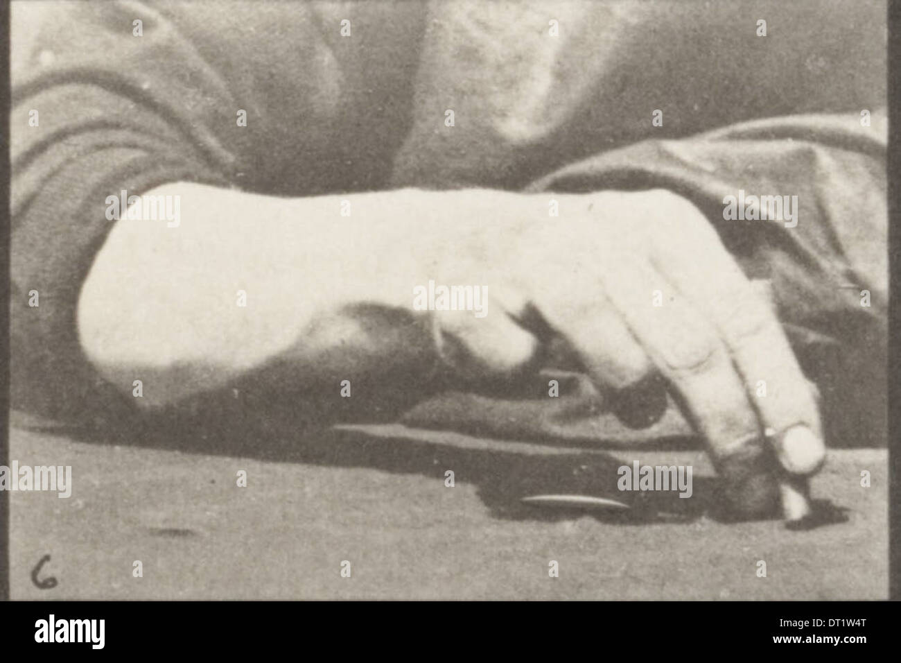 An image showing a hand drawing a precise circle on a surface, likely ...