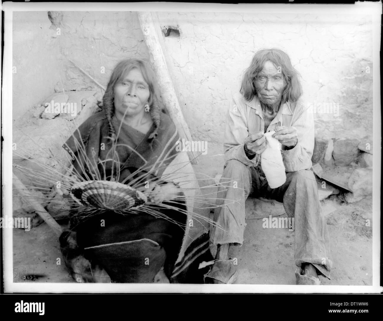 A photograph of a Hopi Indian couple sitting outside, taken around 1900 ...