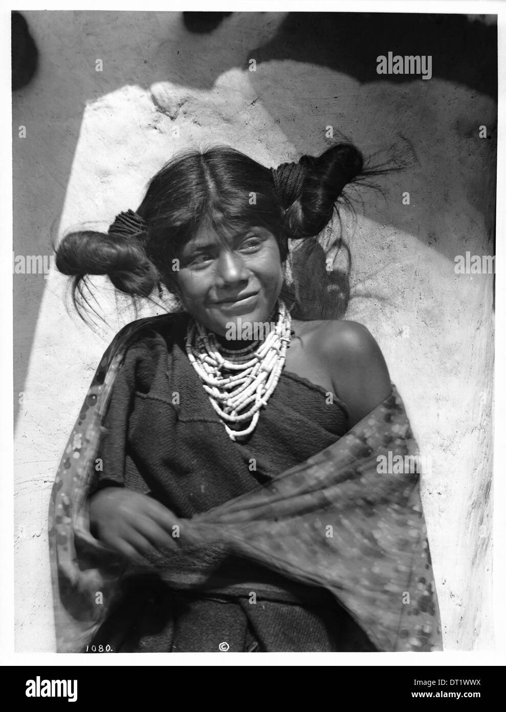 A Hopi Indian maiden standing in the village of Shonguapavi around 1901 ...